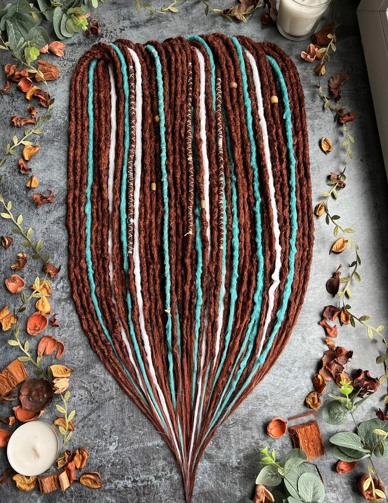 Ginger and teal dreads with white accents, bumpy ginger dreadlock