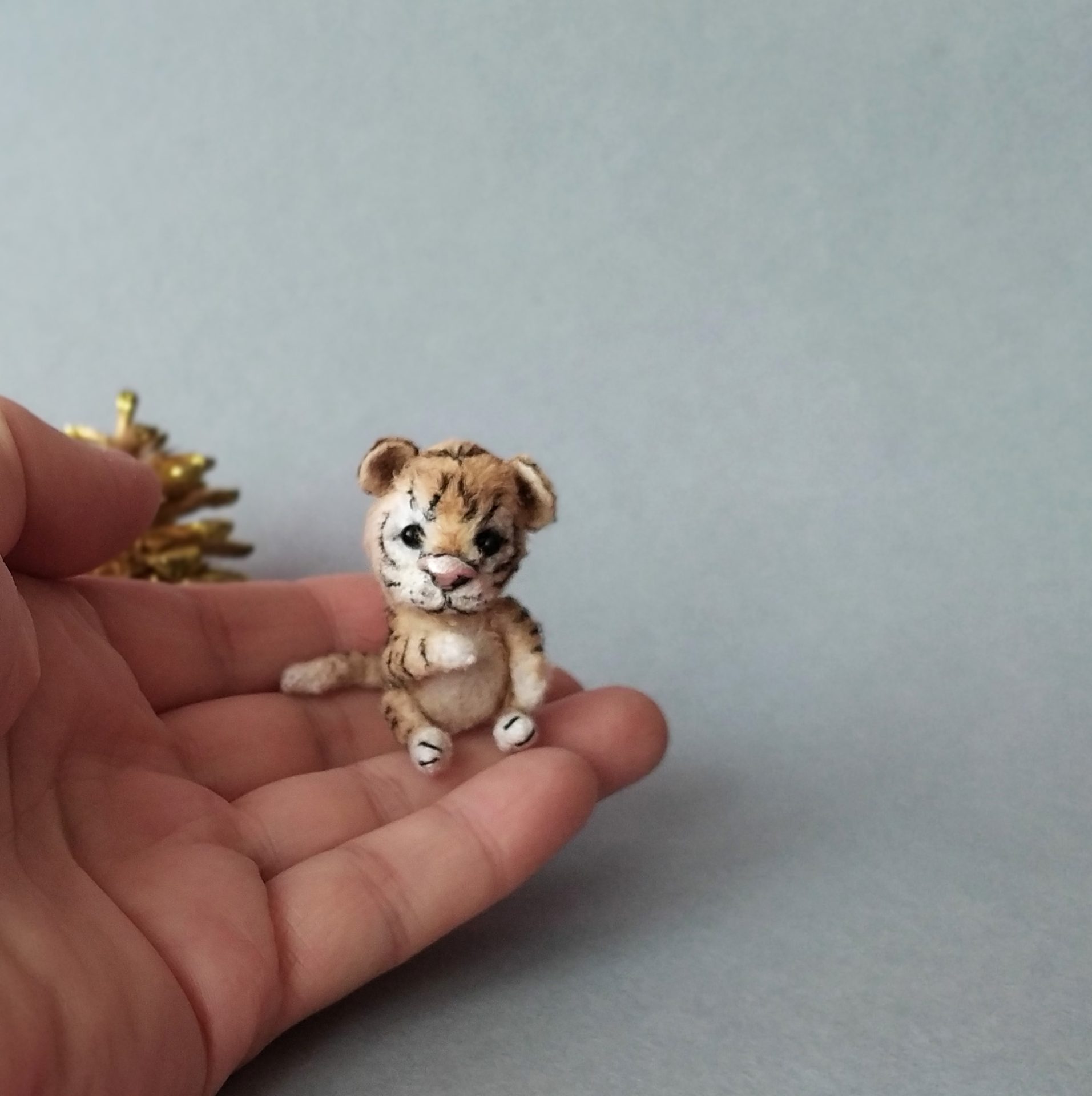 miniature knitted tiger cub amigurumi toy - Crealandia