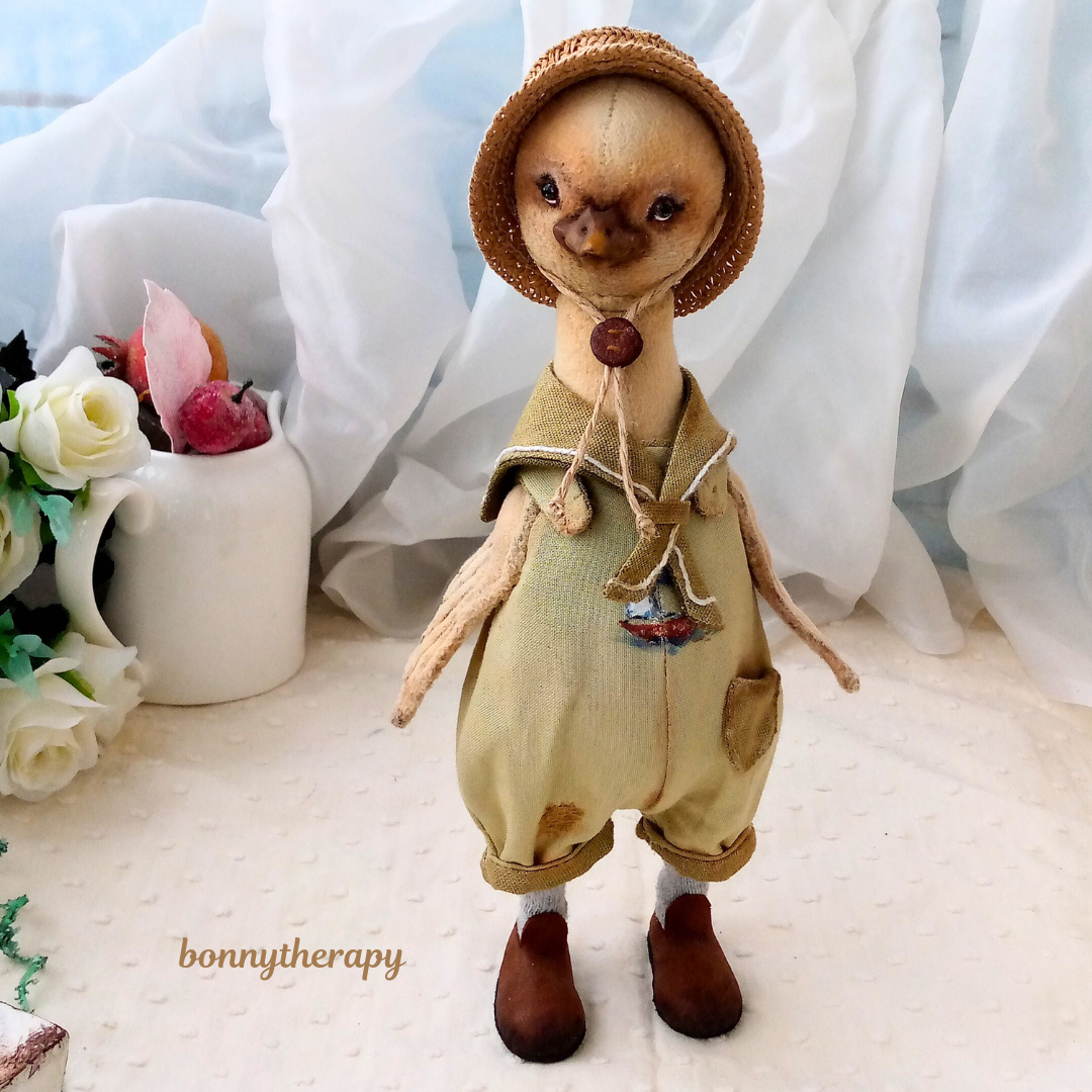 Cute teddy duckling in clothes, duck art doll