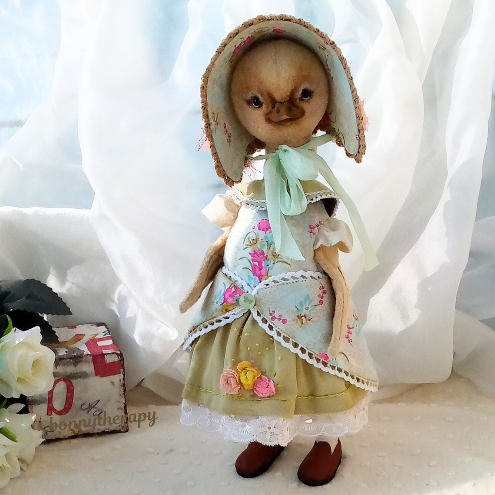 Cute teddy duckling girl in clothes, duck art doll