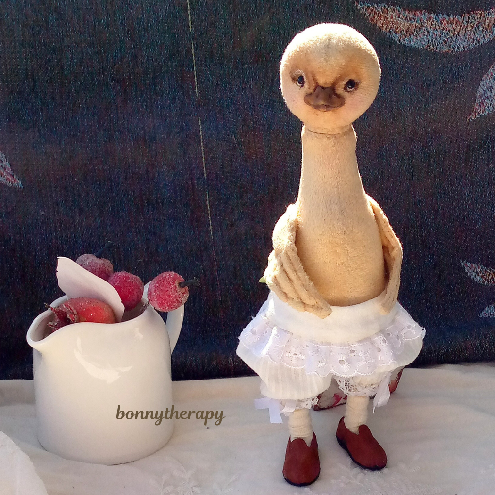 Cute teddy duckling girl in clothes, duck art doll